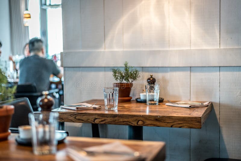 Rustic Country Style Restaurant with White Walls, Table Seating and ...