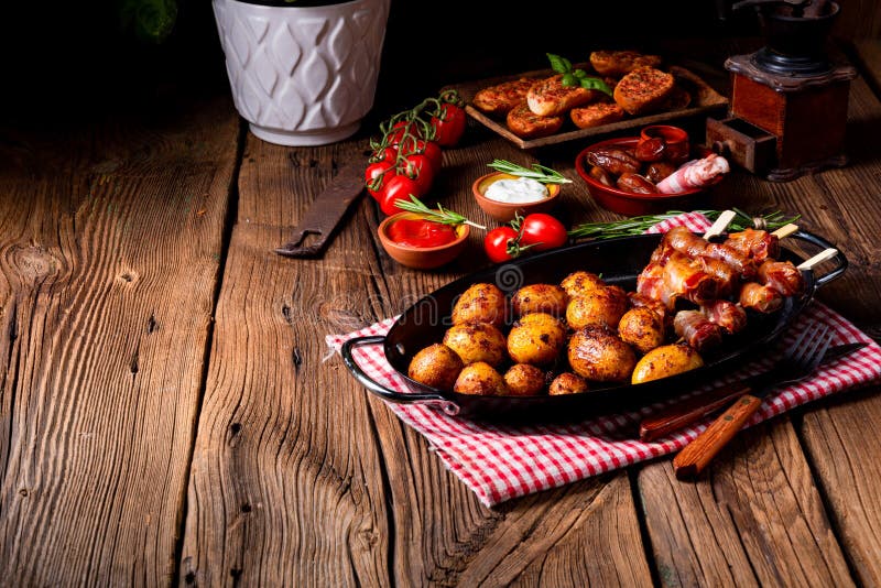 Rustic Dates Wrapped in Bacon and Young Roasted Potato Stock Photo ...
