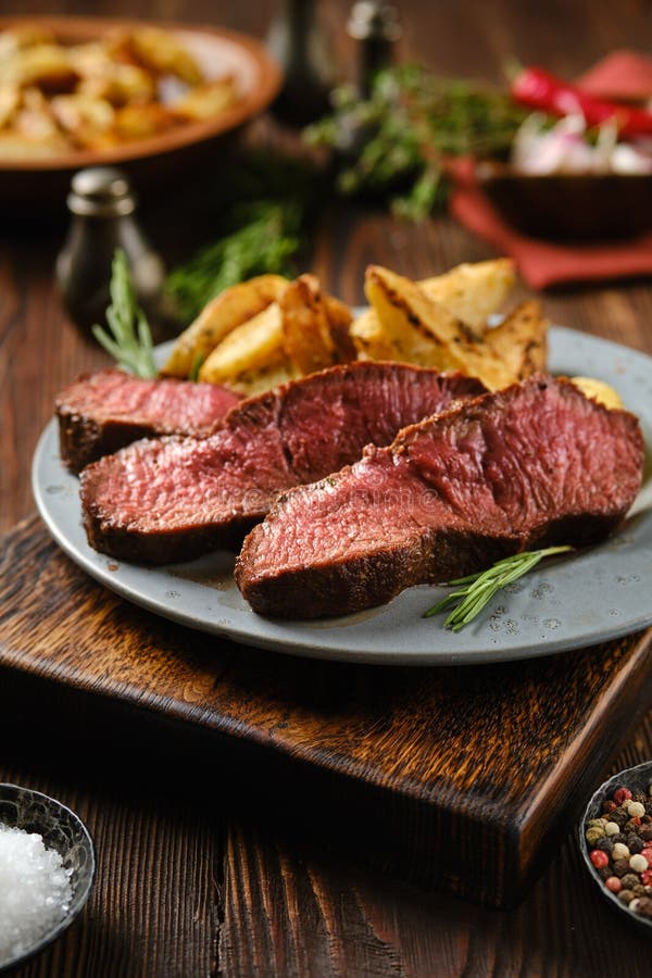 Rustic Dinner with Juicy Top Blade Beef Steak on a Plate Stock Image ...