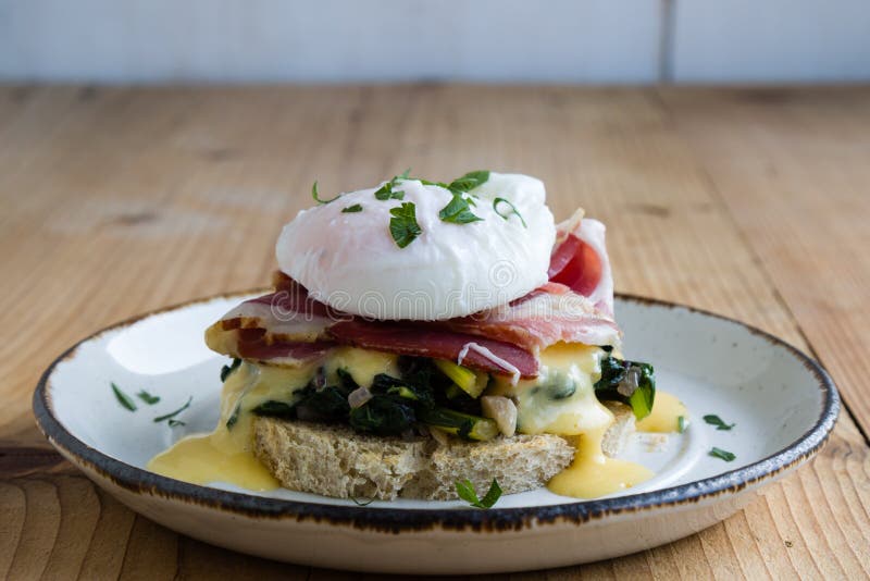 Rustic eggs benedict stock image. Image of white, yellow - 100847659