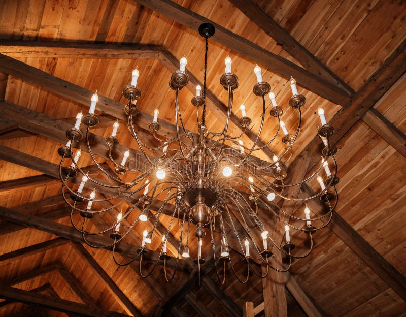 Rustic Elegance: Grand Chandelier Illuminating Wooden Cathedral Ceiling Stock Photo - Image of ...