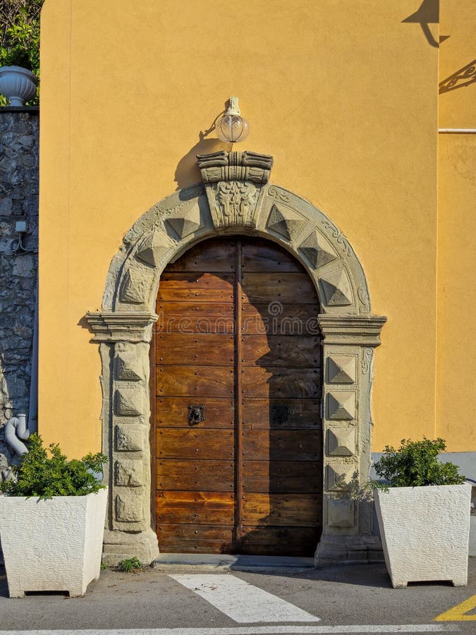 Rustic Facade with Medieval Style Door in Positano, Italy. Stock Photo ...