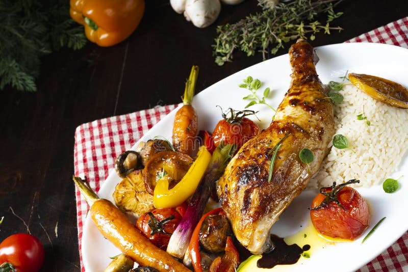Rustic Fried Chicken Legs with Assorted Vegetables and Rice Stock Image ...