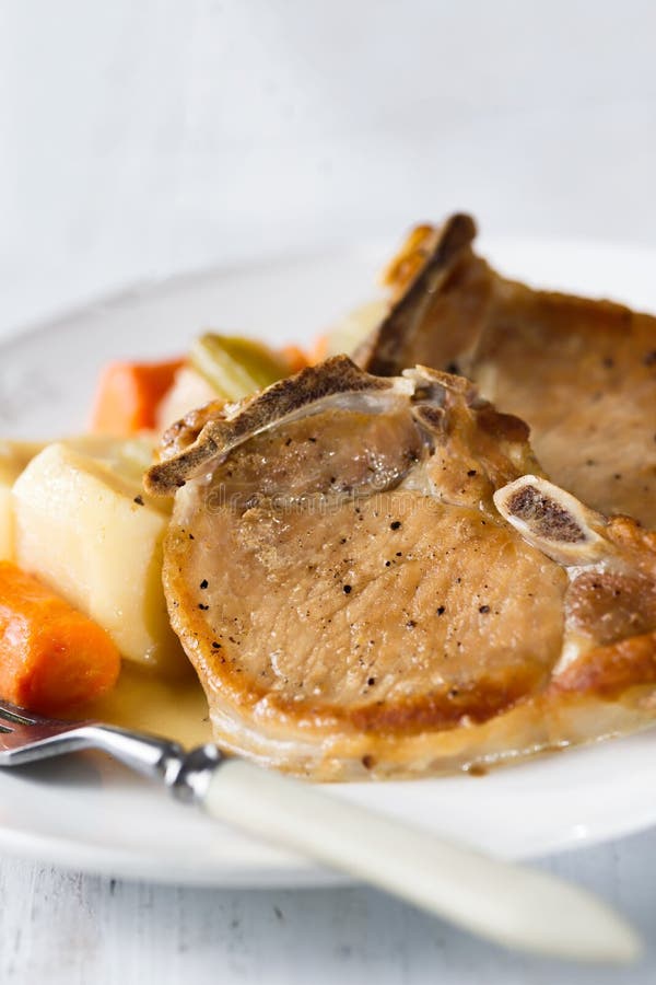 Rustic Germain Braised Pork Chop Stock Photo - Image of root, pork ...