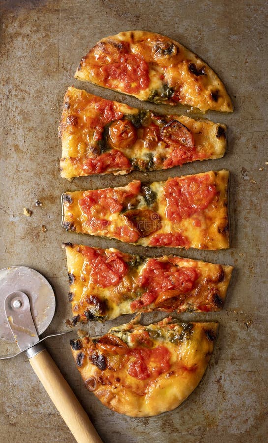 Rustic Gourmet Oval Italian Pizza Stock Photo - Image of junk, cherry ...