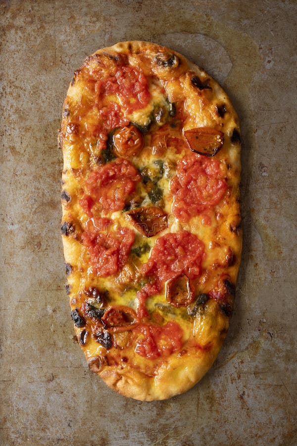 Rustic Gourmet Oval Italian Pizza Stock Photo - Image of junkfood ...