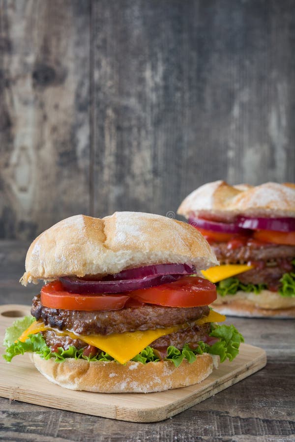 Rustic Homemade Burger on Wood Stock Photo - Image of tomato, burger ...