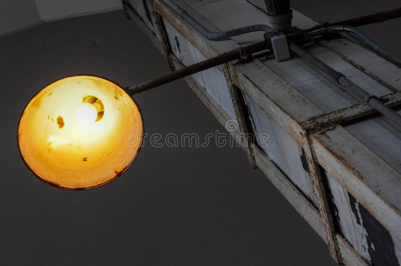 Rustic Industrial Ceiling Light Casting Warm Glow in Minimalist Setting ...