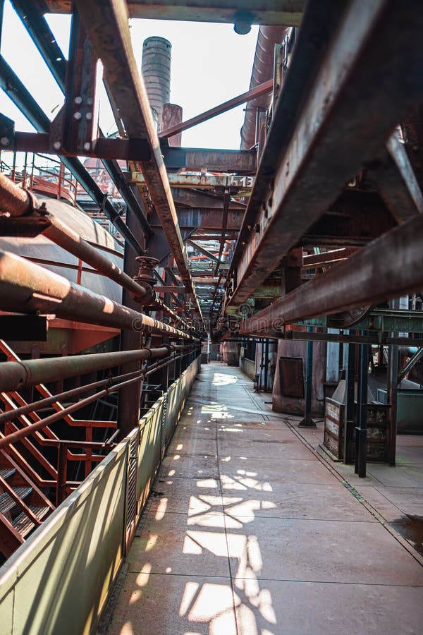 Rustic Industrial Facility Featuring Steel Structure with Pipelines and ...