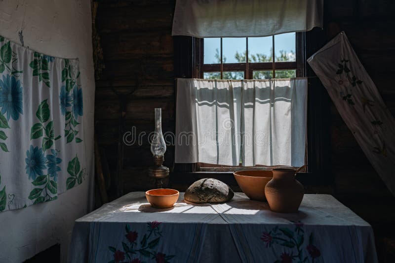 Rustic Interior with a Window Bathed in Sunlight. the Room is Dimly Lit ...