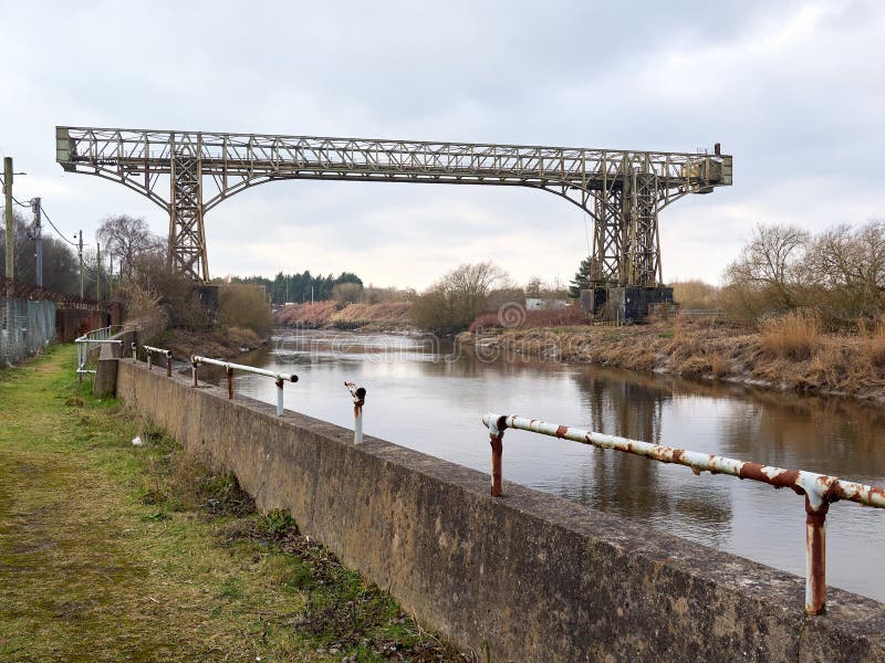 Rustic Iron Bridge Spanning Over a Calm River on a Cloudy Day ...