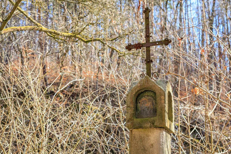 Rustic Iron Cross on Stone Pedestal in Overgrown Forest Setting Stock Photo - Image of branches ...