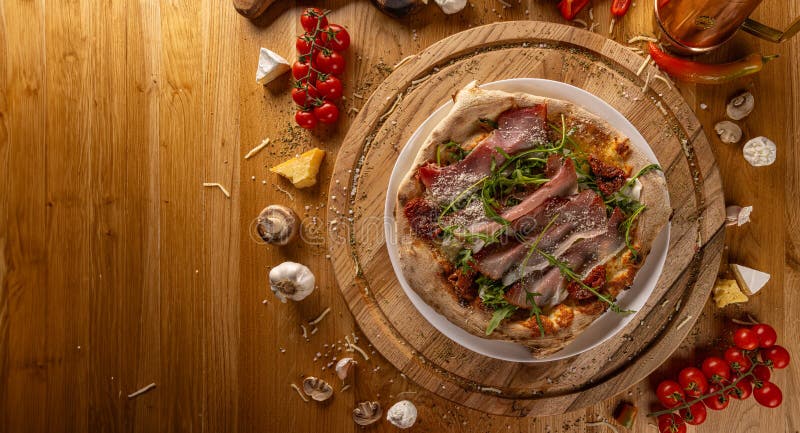 Rustic Italian Pizza with Arugula and Prosciutto Stock Image - Image of ...