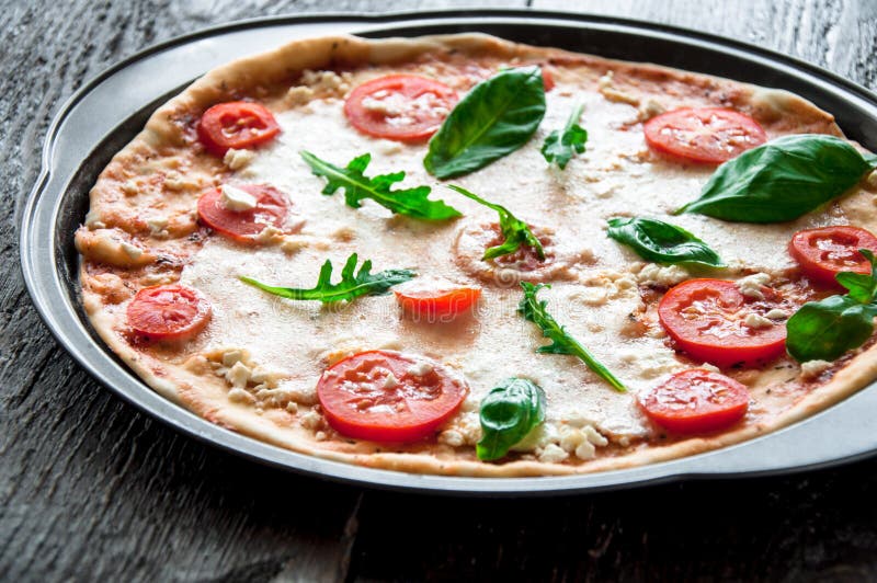 Rustic Italian Pizza with Mozzarella, Cheese and Basil Stock Photo ...