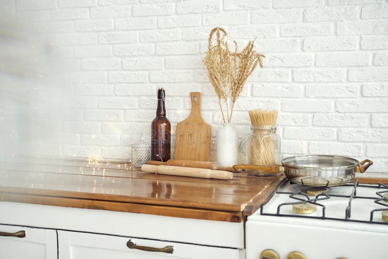 Rustic Kitchen Counter with Rolling Pins, Dried Plants, and Stainless ...