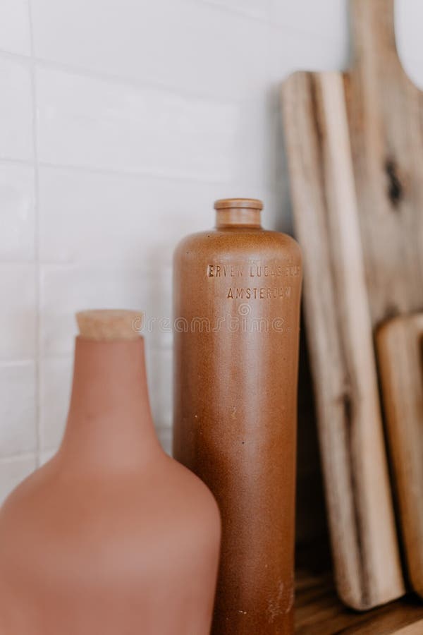 Rustic Kitchen Countertop with a Selection of Ceramic Pots and Bowls on ...