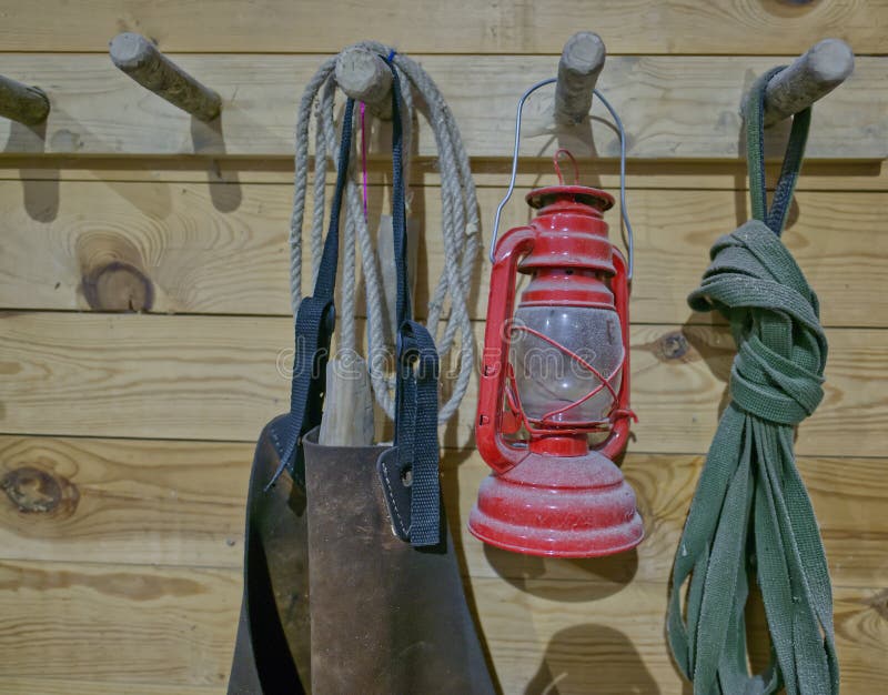 Rustic Lantern and Tools on Wooden Pegs Stock Image - Image of ...
