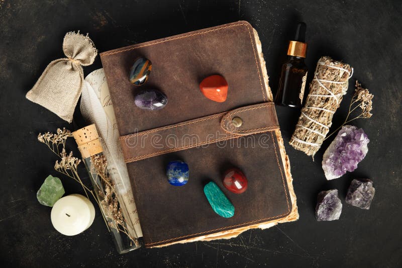 Rustic Leather Journal with Healing Crystals on Dark Background Stock ...