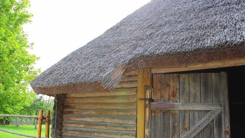 Old Log Barn with Thatched Roof and Gate in the Village, Beautiful ...