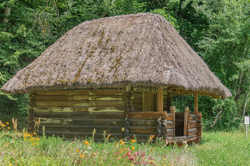 Rustic Log Cabin with Conical Thatched Roof in Central European Rural ...