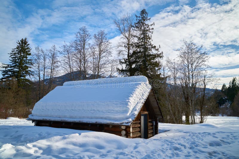 Rustic Log Cabin in Winter stock photo. Image of travel - 258344016