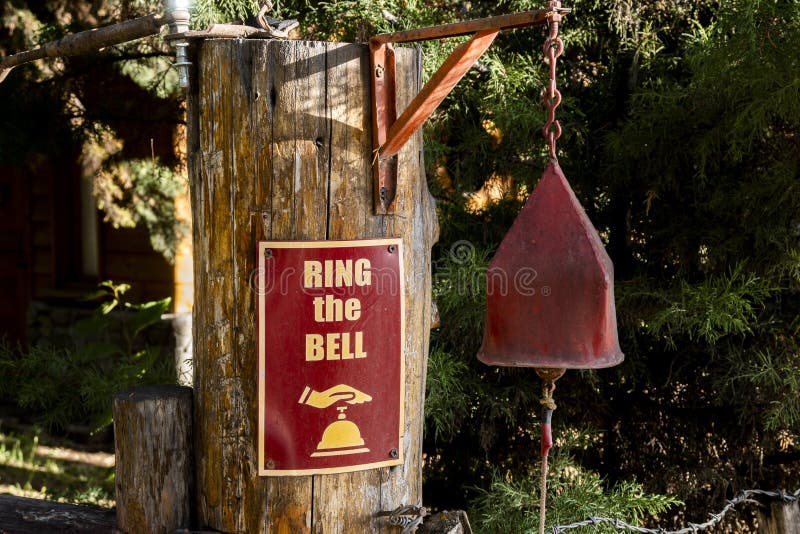Rustic Metal Bell Hung with a Sign that Says "ring the Bell Stock Photo ...