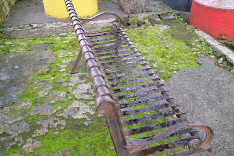 Rustic Metal Bench on Mossy Stone Pavement Stock Photo - Image of metal ...