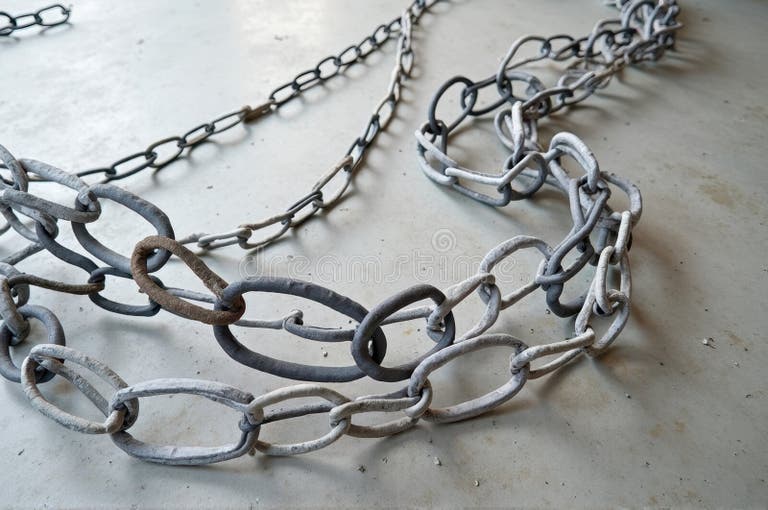 Rustic Metal Chains on Concrete Floor with Shadows and Texture Details ...