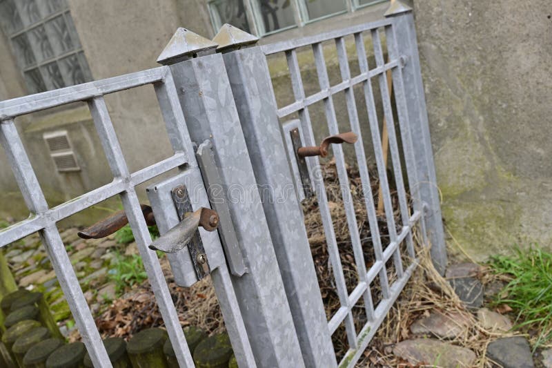 Rustic Metallic Gate with Latch and Overgrown Foliage Stock Photo ...