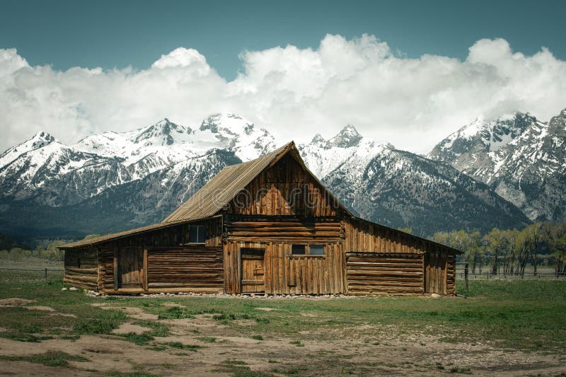 Rustic Moulton Barn Against the Snow-capped Mountains in Yellowstone ...