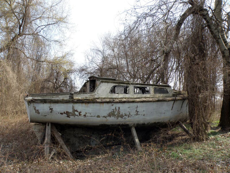 Rustic Old boat with trees stock image. Image of water - 122677839