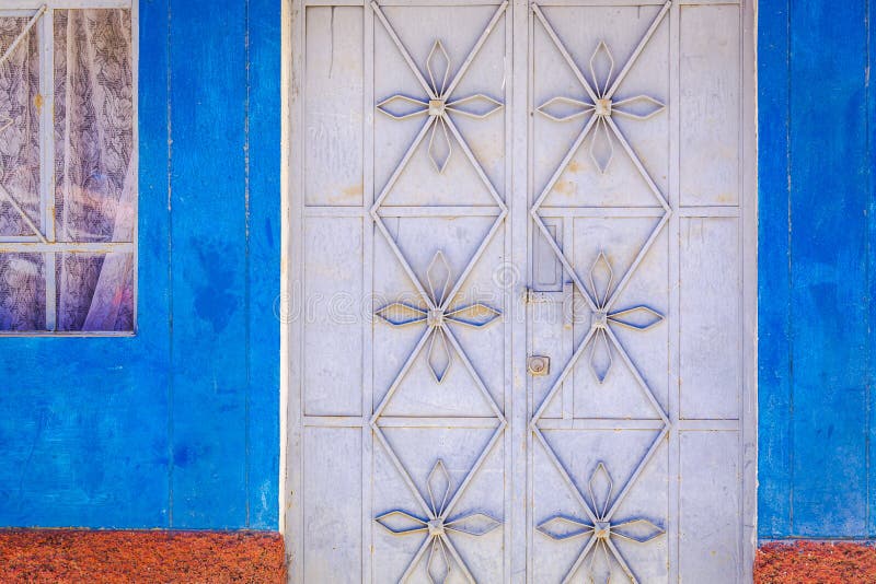 Rustic Old Metal Door with Textured Adobe Wall Facade in Cusco, Peru ...