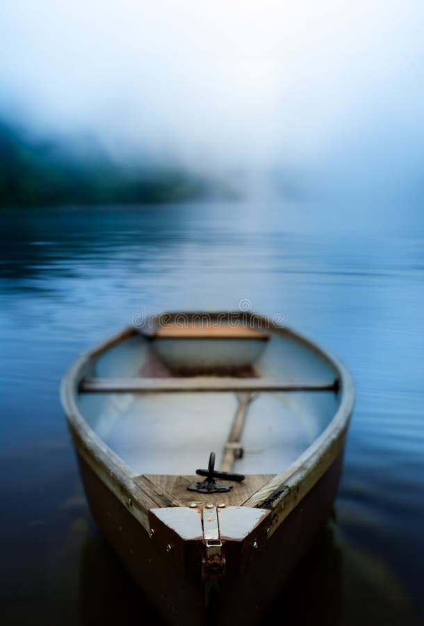 Rowing Boat on Misty Lake stock image. Image of empty - 320682807
