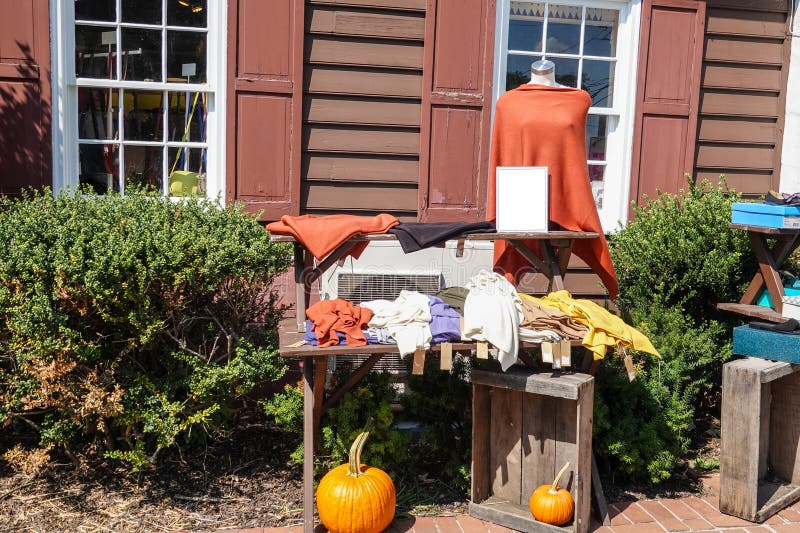 Rustic Outdoor Clothing Display of Fall Tops in Front of a Store with ...