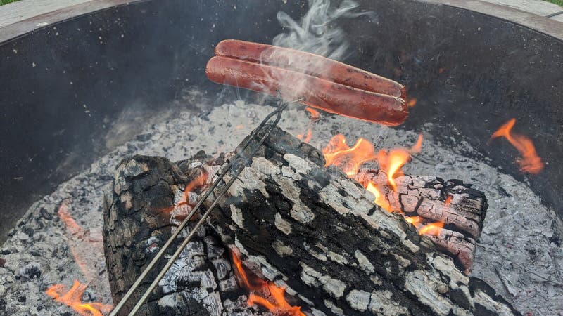 Rustic Outdoor Fire Pit Cooking with Roasting Hot Dogs Stock Photo ...