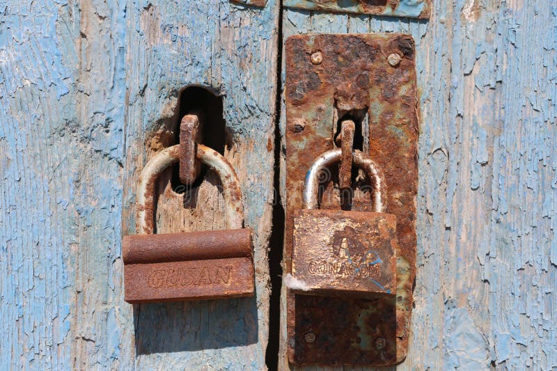Rustic Padlock is Securely Fastened Onto a Wooden Door, with Distressed ...