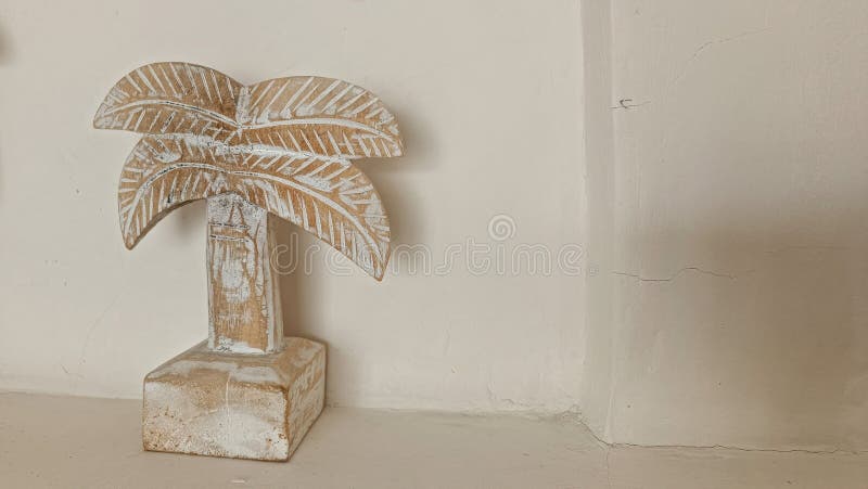 Rustic Palm Tree Sculpture Against Minimalist Wall Stock Image - Image ...
