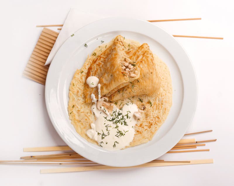 Rustic Pancakes with Meat on a Plate in the Form of a Triangle, Close ...