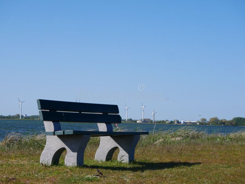 Rustic Park Bench in Front of a Tranquil Beach on the German Island of ...