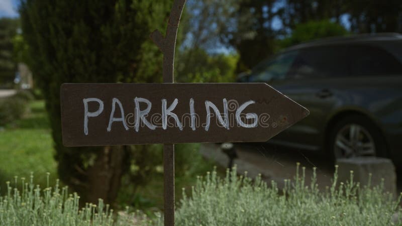Rustic Parking Sign in an Outdoor Garden with Blurred Car and Greenery ...