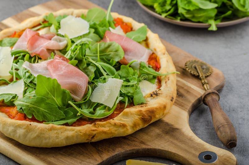 Rustic parma ham pizza stock photo. Image of chive, mozzarella - 77565162