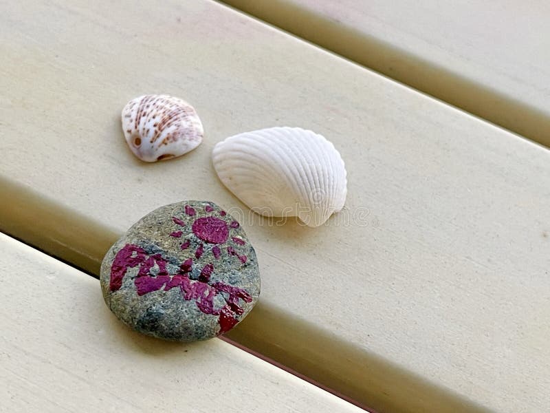 Rocks, Shells, and a Rose Pattern Painted on a Piece of Wood Stock ...