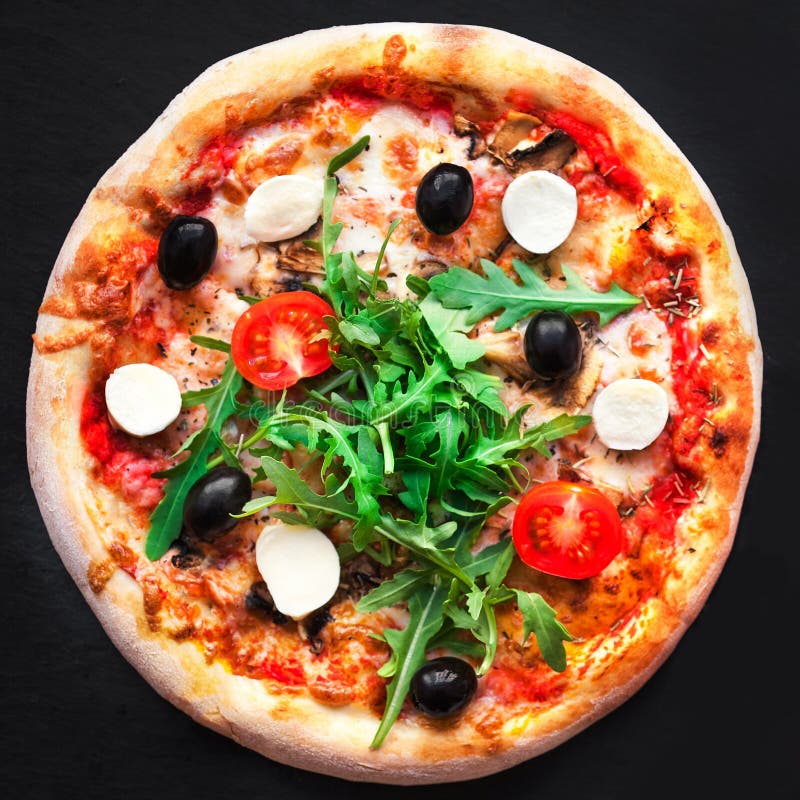 Rustic Pizza with Mozzarella, Four Cheese, Olives and Arugula T Stock ...