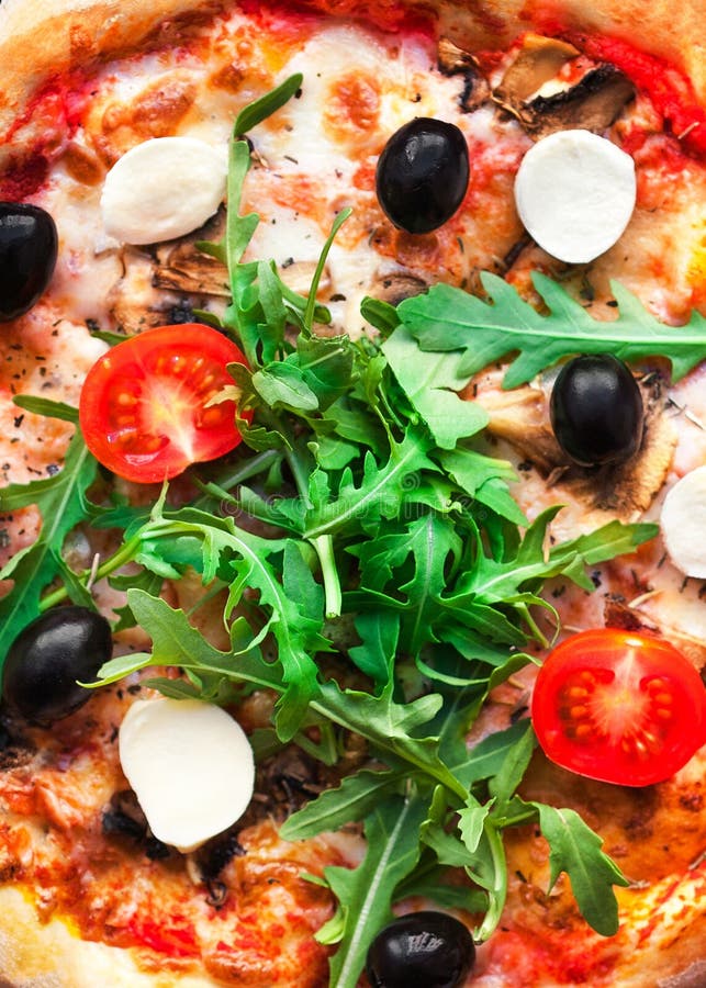 Rustic Pizza with Mozzarella, Four Cheese, Olives and Arugula T Stock ...