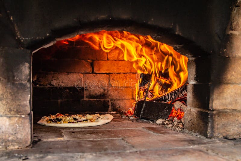 Fire in rustic pizza oven stock image. Image of baking - 120708309