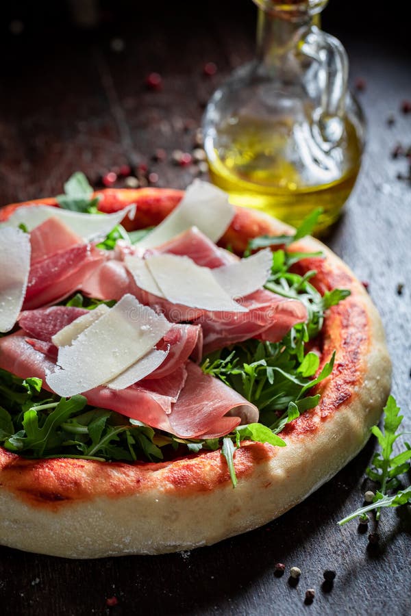 Rustic Pizza Parma with Parmesan Cheese and Parma Ham Stock Photo ...