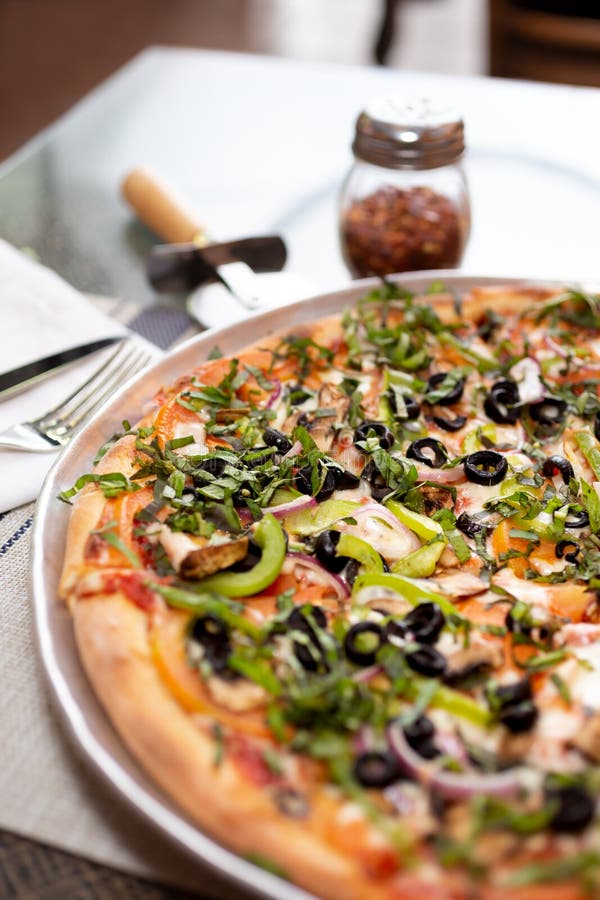 Rustic pizza pizza basil stock image. Image of peppers - 192736195