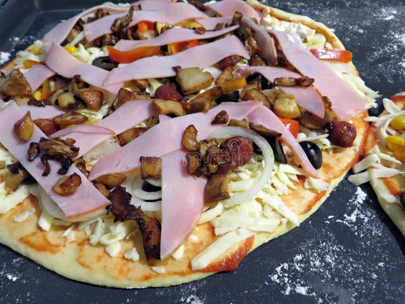 Rustic pizza ready to bake stock photo. Image of cuisine - 135400400