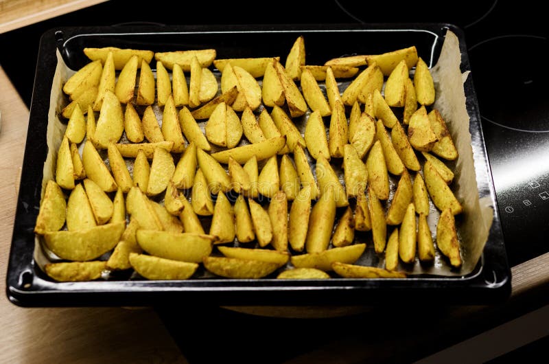 Rustic Potatoes on a Black Baking Sheet Stock Image - Image of american ...