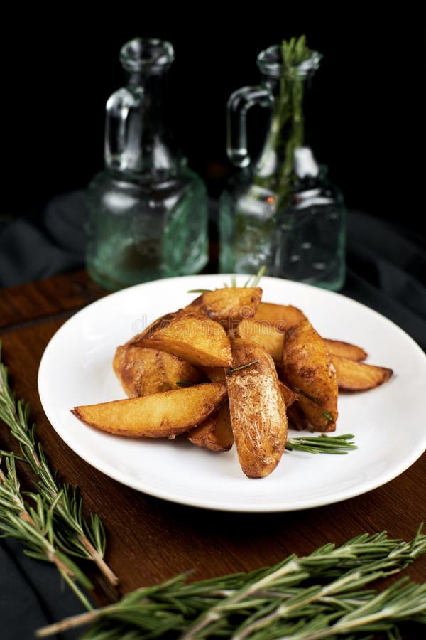 Rustic Potatoes on a Dark Background. Stock Image - Image of rosemary ...